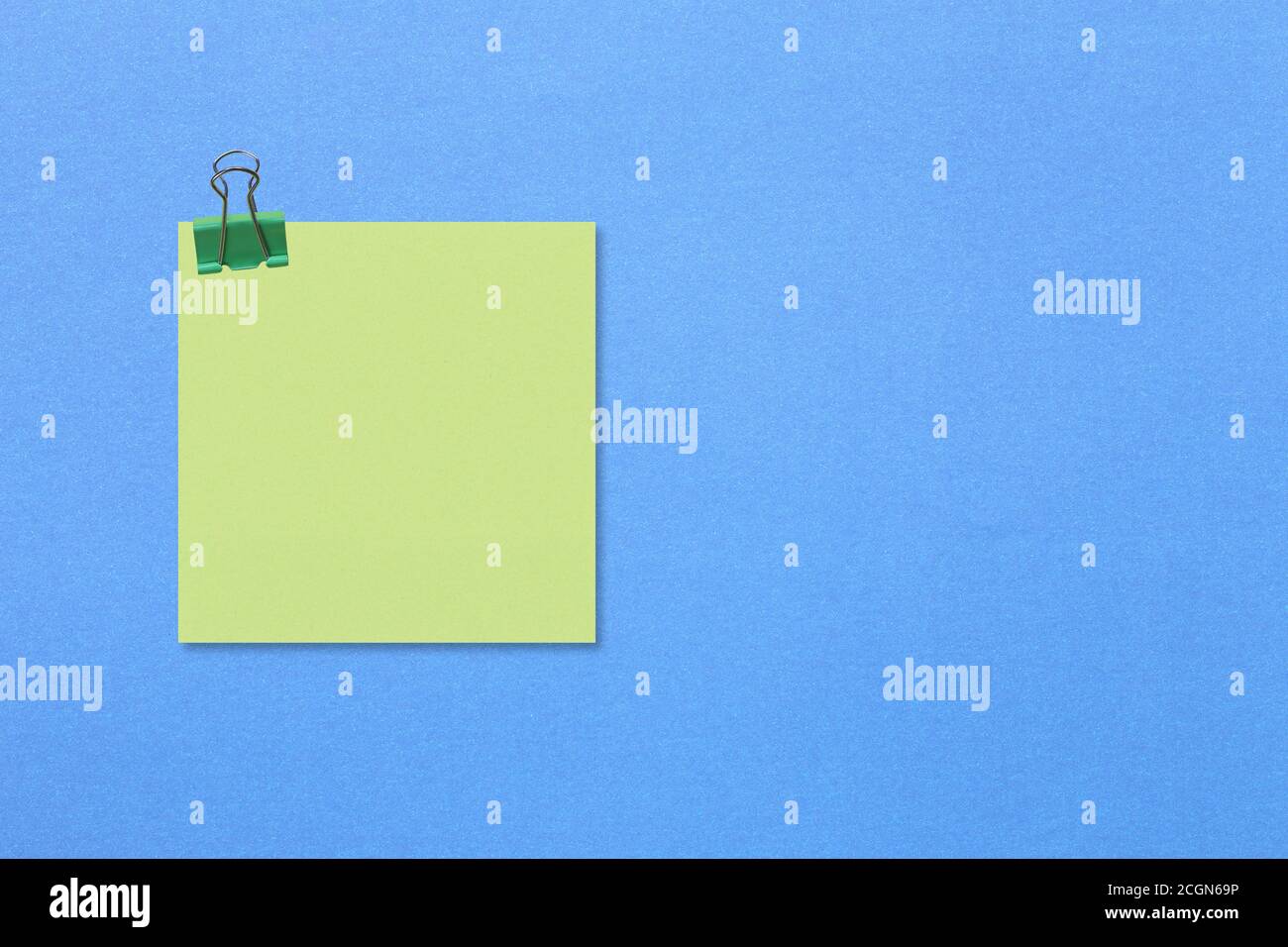 Colorful square note paper on blue paper background and have copy space ...