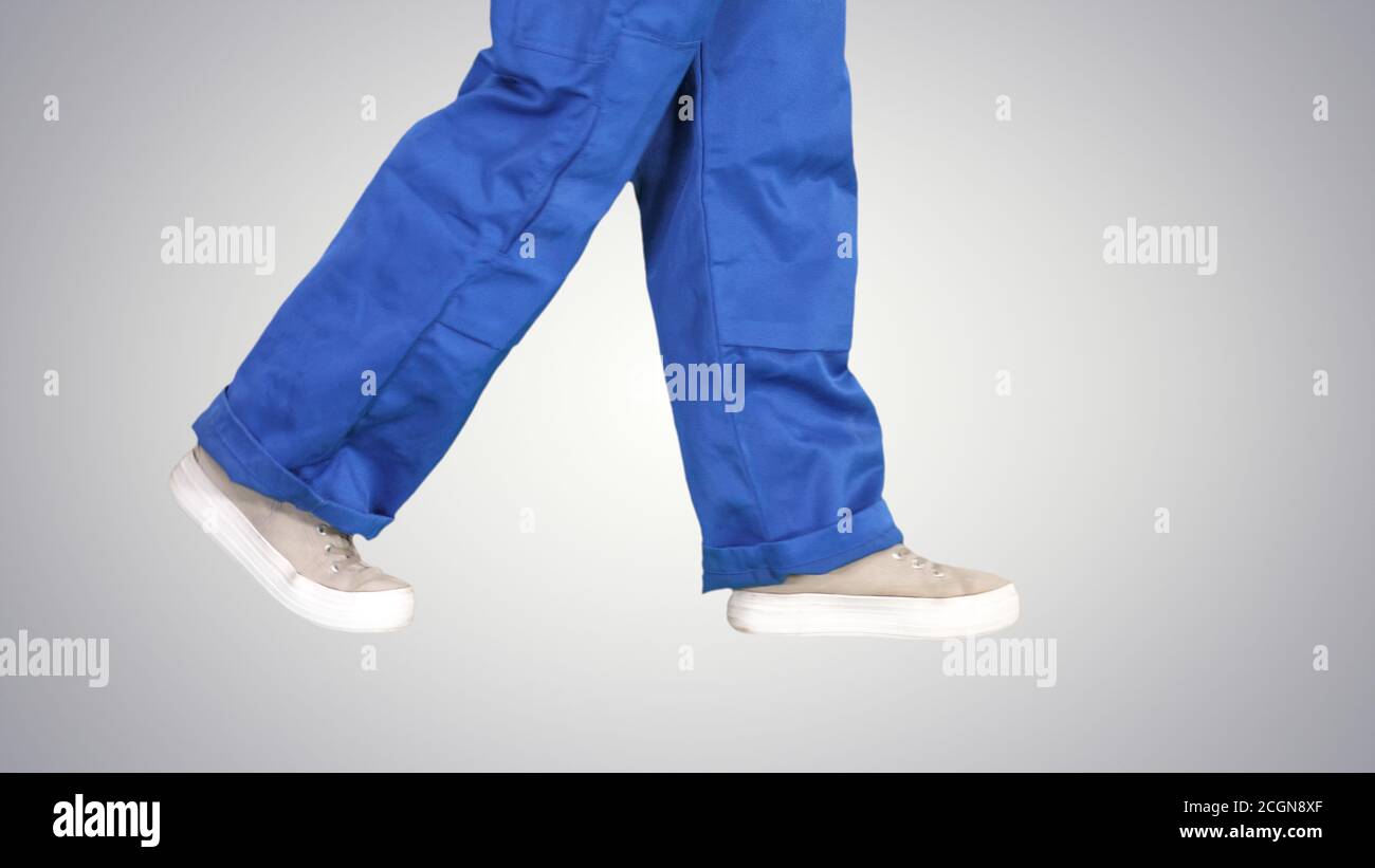 Legs of woman construction worker walking on gradient background Stock ...