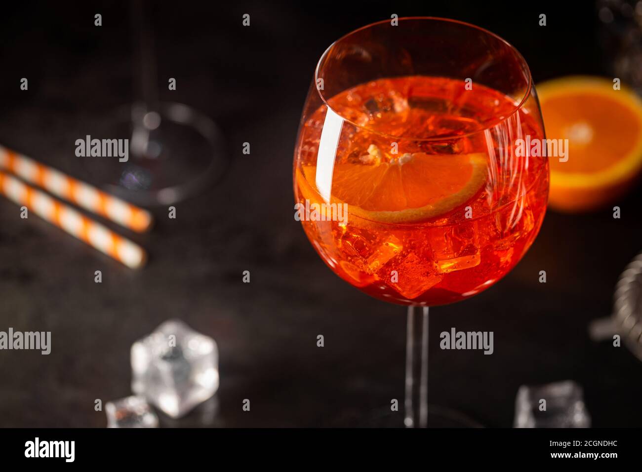 Aperol spritz cocktail in glass with fresh orange on dark background ...