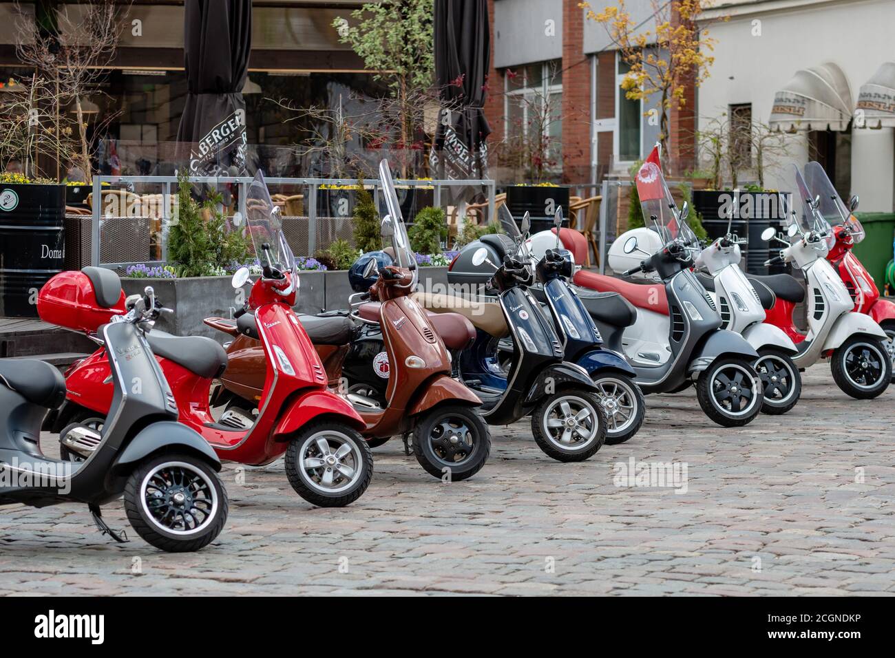 RIGA, LATVIA - MAY 4, 2019: Row of classic vespa scooter parked in the ...