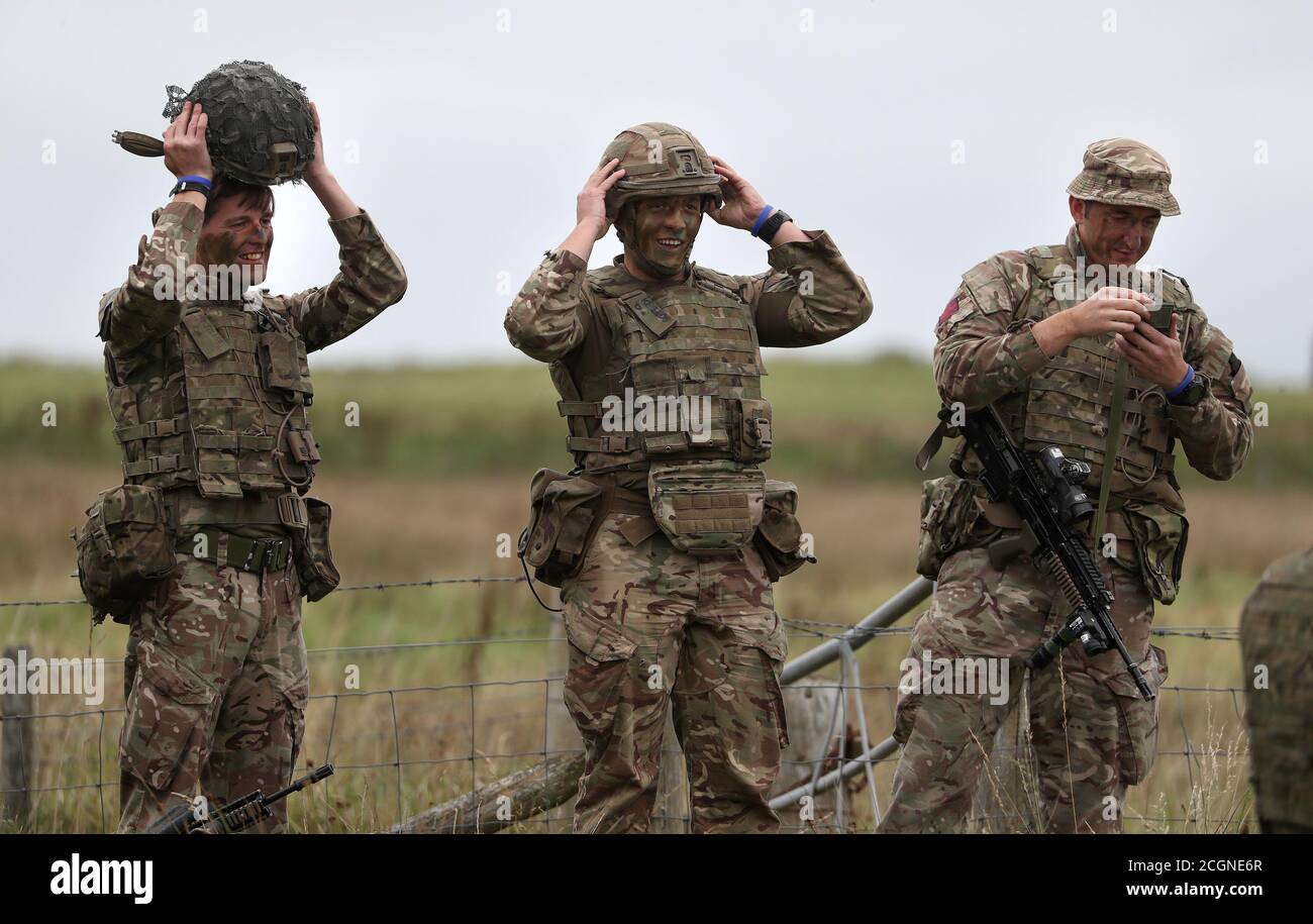 Soldiers from the Royal Scots Dragoon Guards get ready to patrol during ...