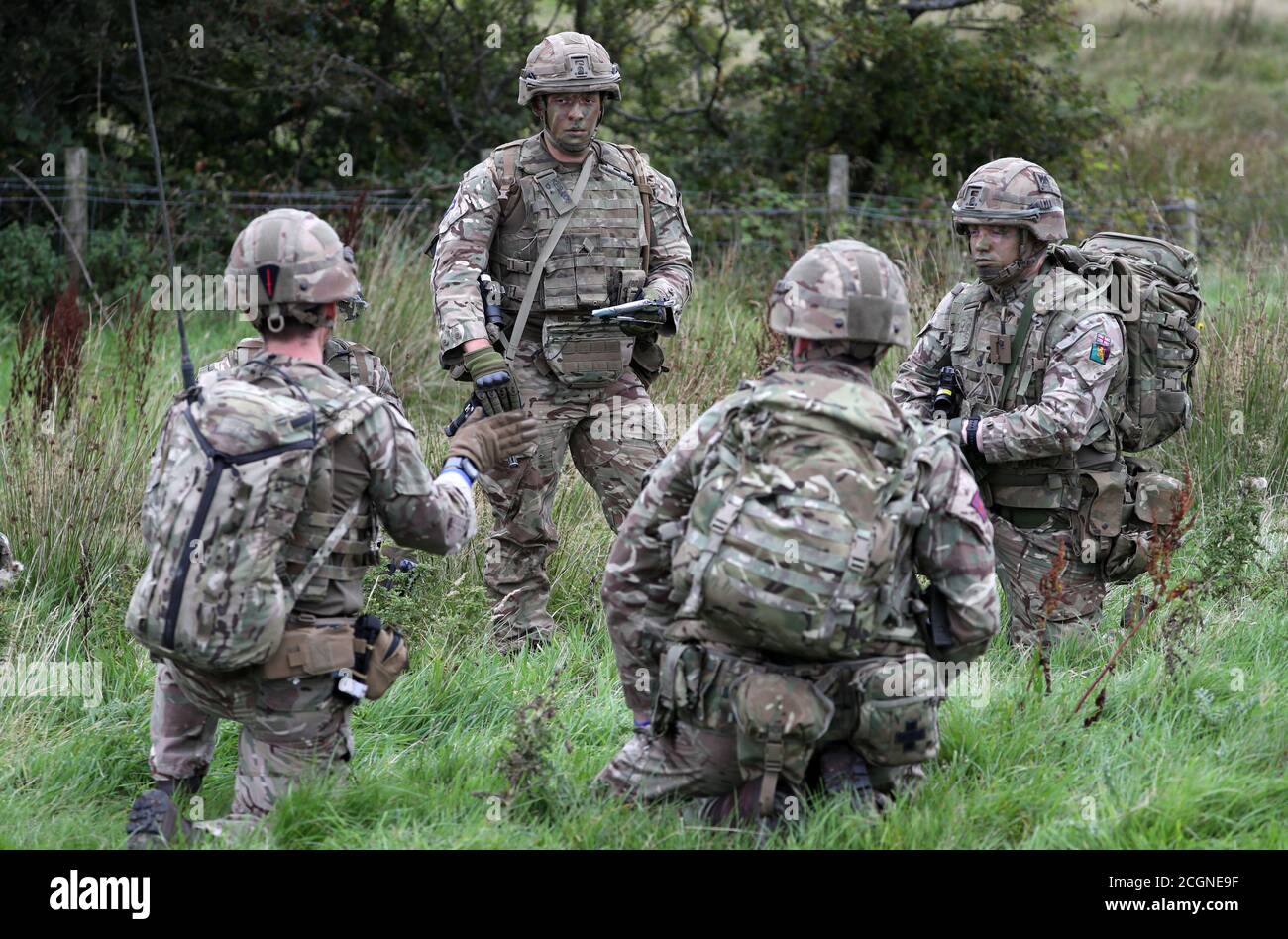 Soldiers from the Royal Scots Dragoon Guards get ready to patrol during ...