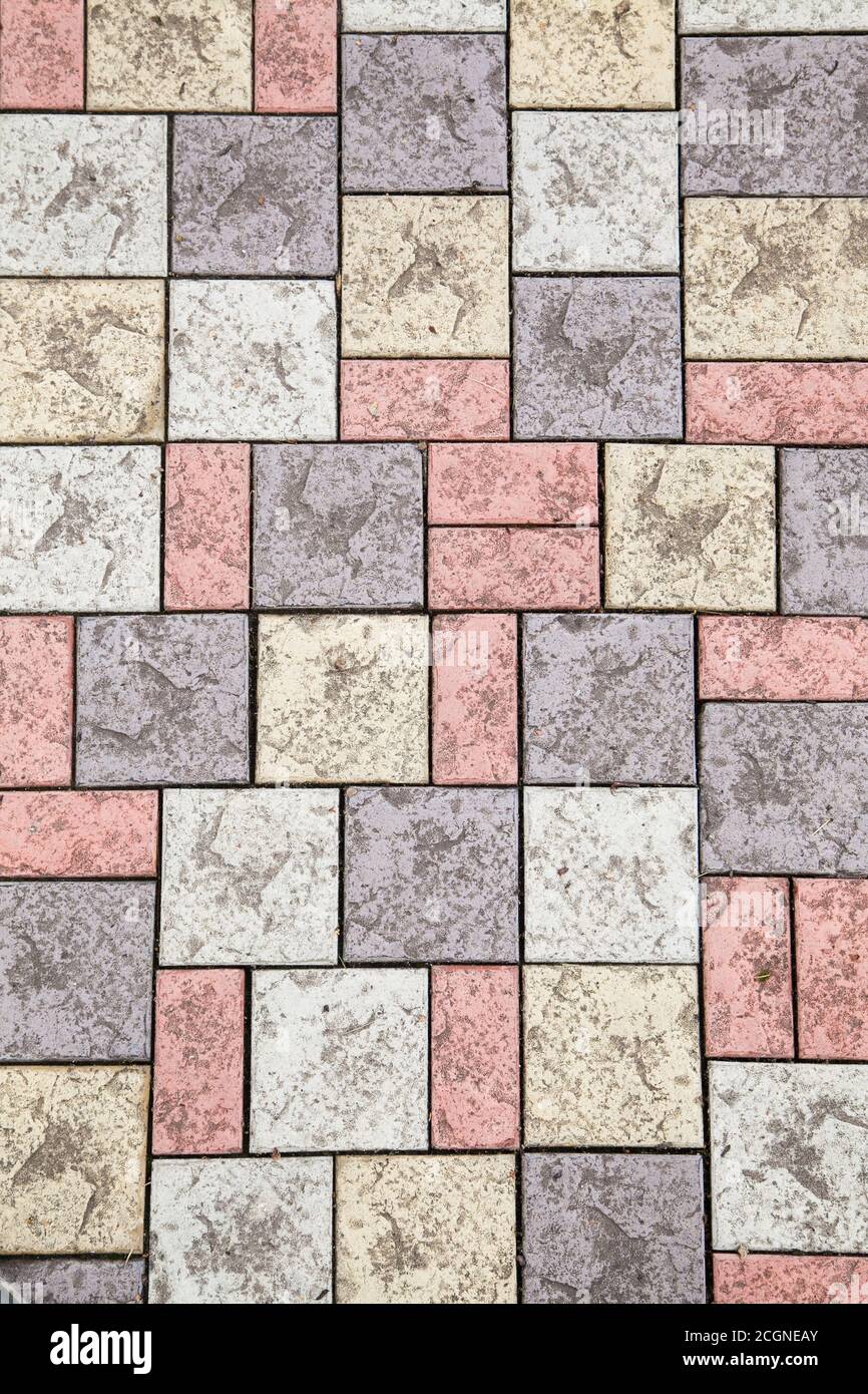 Vertical closeup of colored walking tile pavement Stock Photo - Alamy