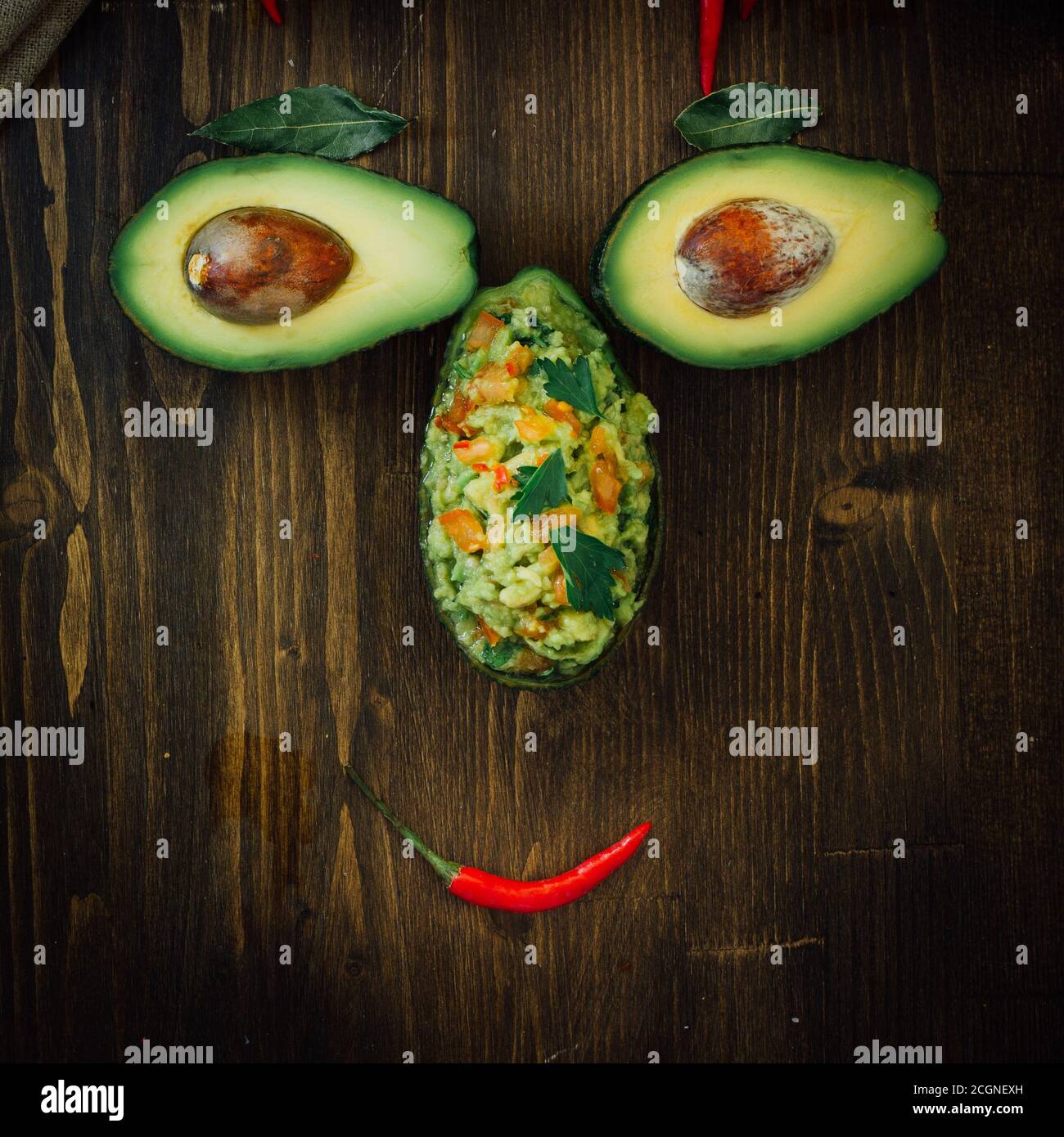Funny food face made from avocado and guacamole dip Stock Photo - Alamy