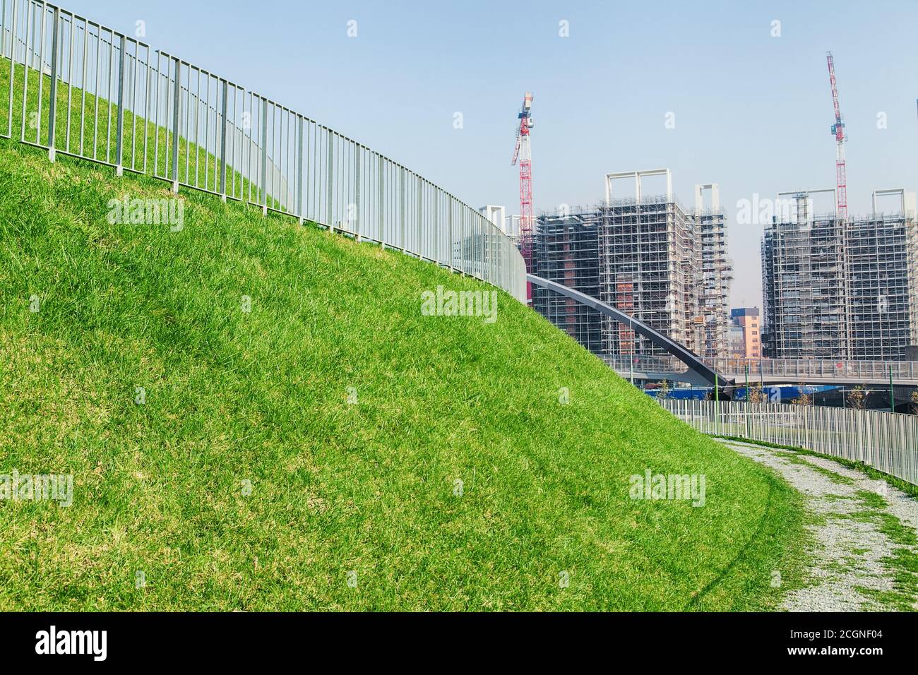 Green grass in park with construction site Stock Photo - Alamy