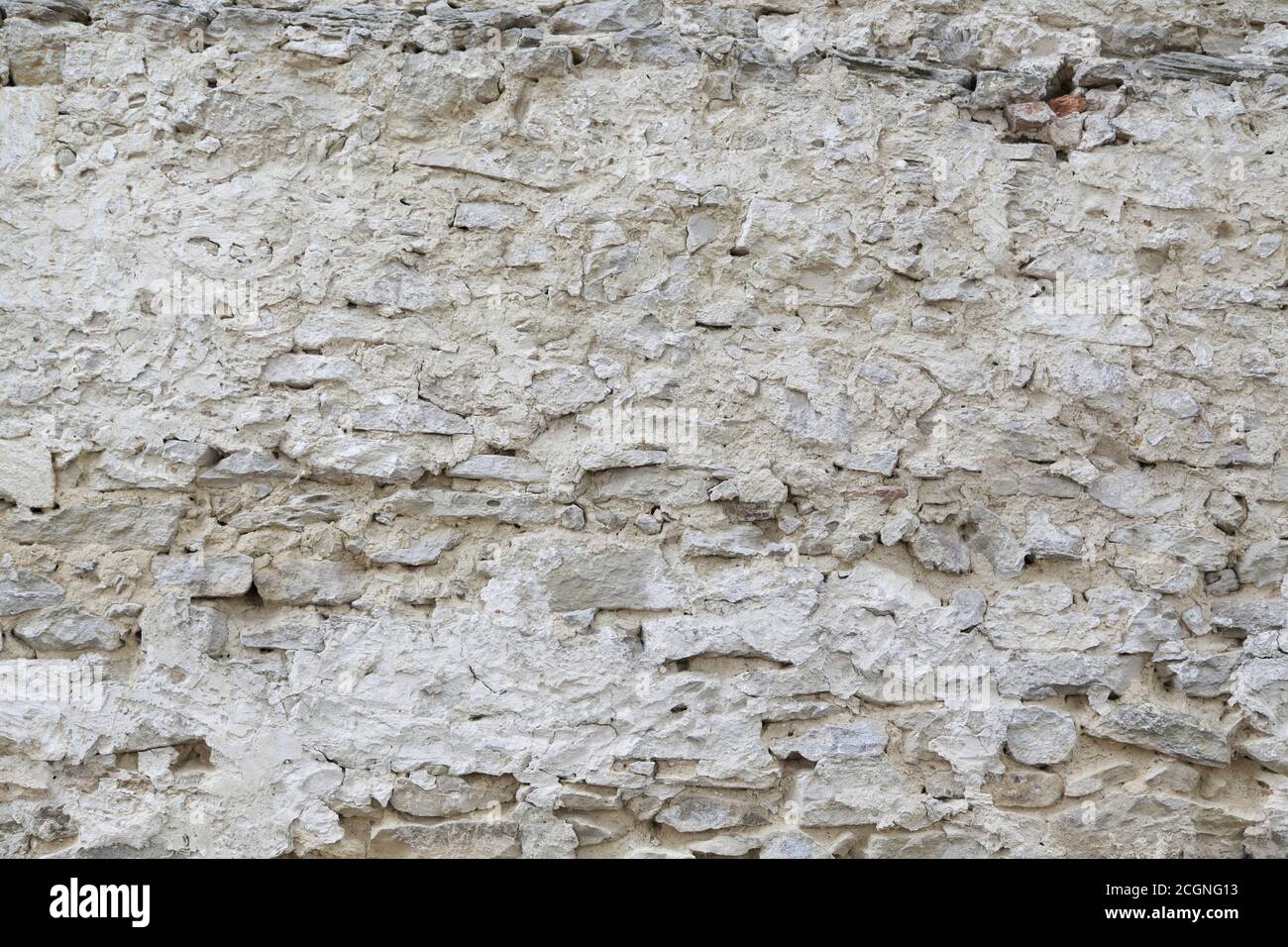 Wall of stones with mortar Stock Photo - Alamy