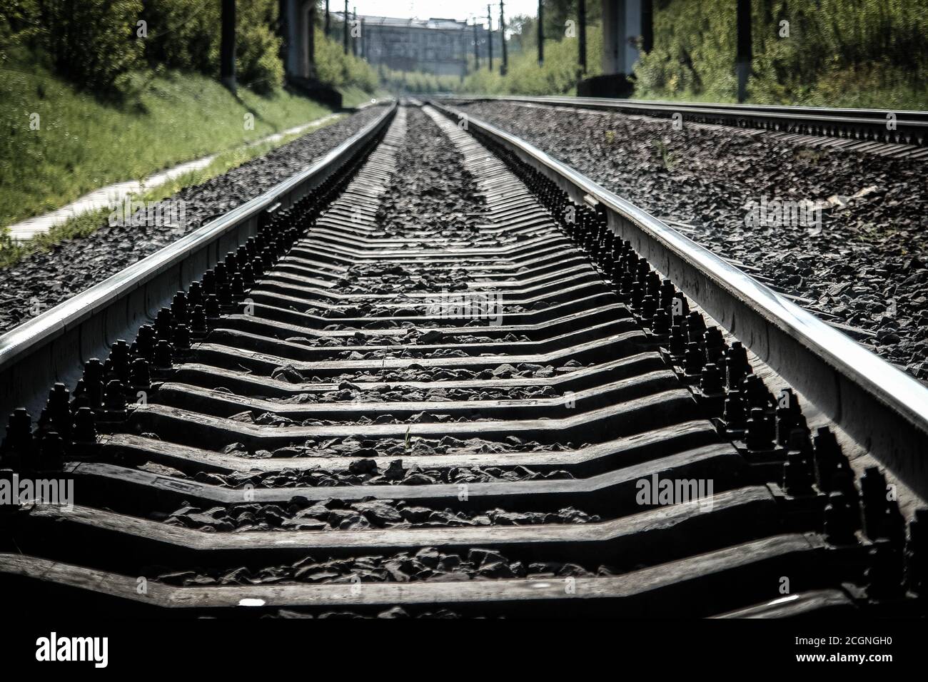 Raiway road, rails going ahead on cloudy day Stock Photo - Alamy