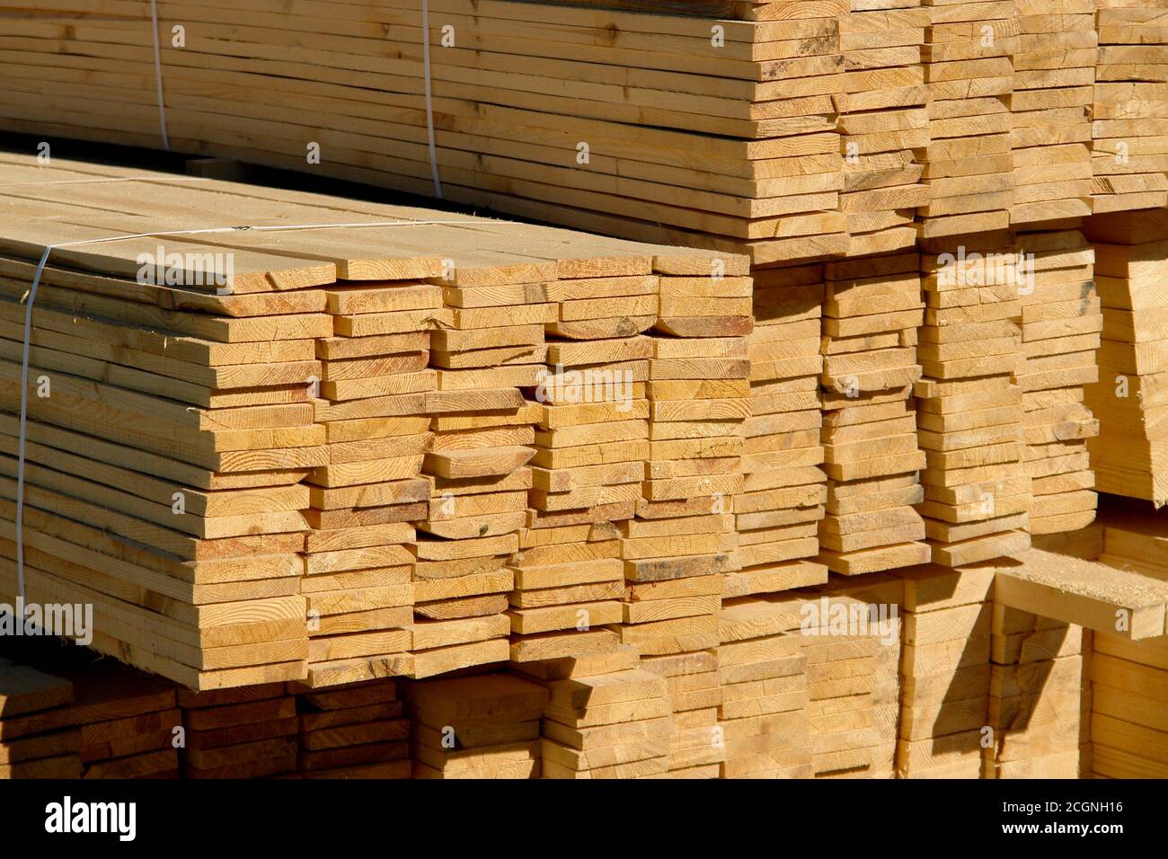 Wooden planks on timber yard, warehouse or sawmill Stock Photo - Alamy