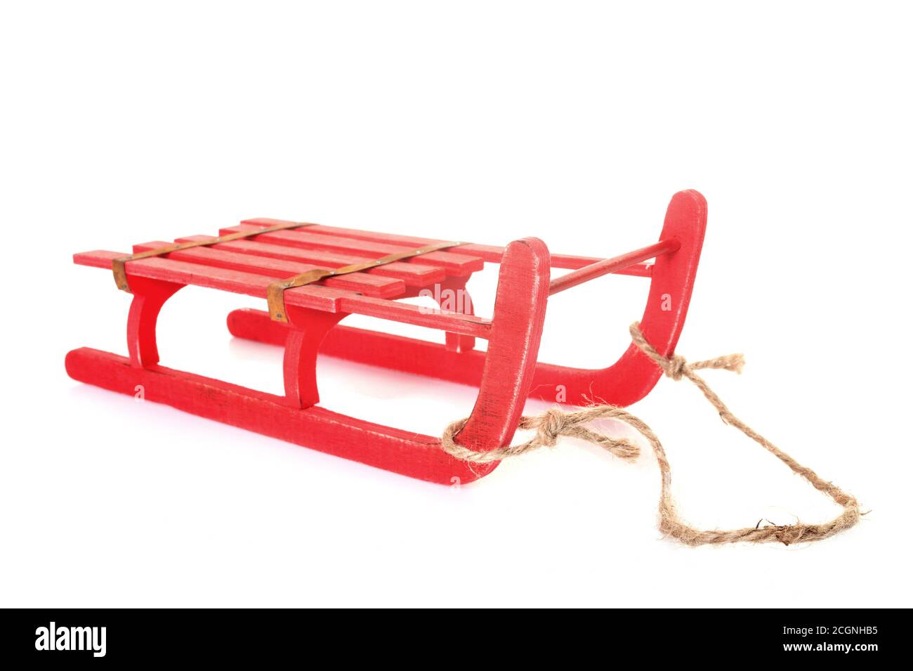 red sledge in front of white background Stock Photo - Alamy