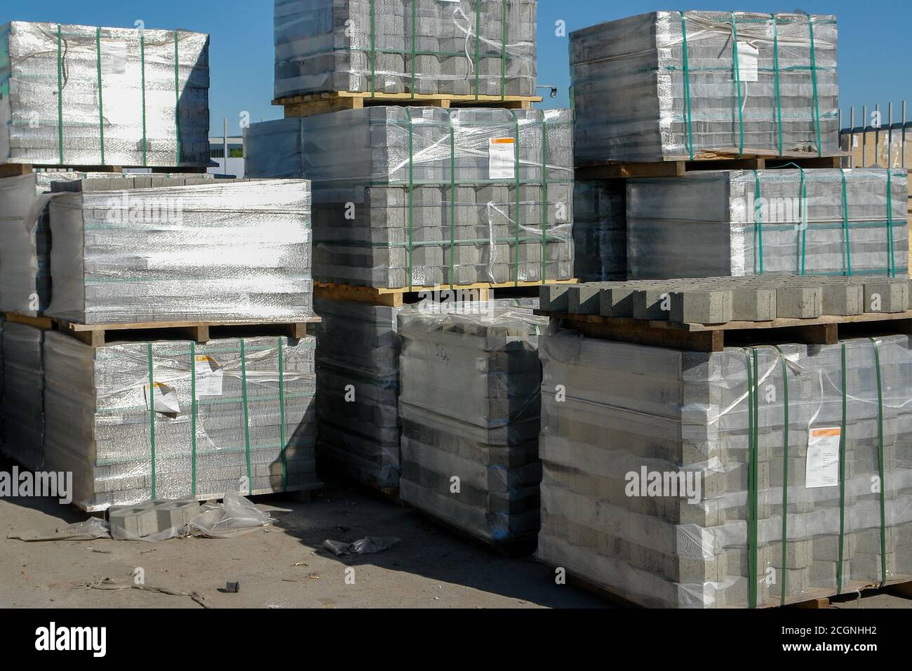 Pavement stones on market. Paving slabs store. Cobblestone on pallets ...