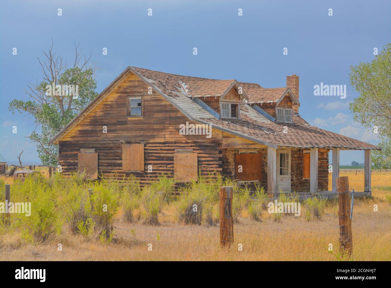 A rustic, rundown, old abandoned, ruined, farm house in the countryside ...