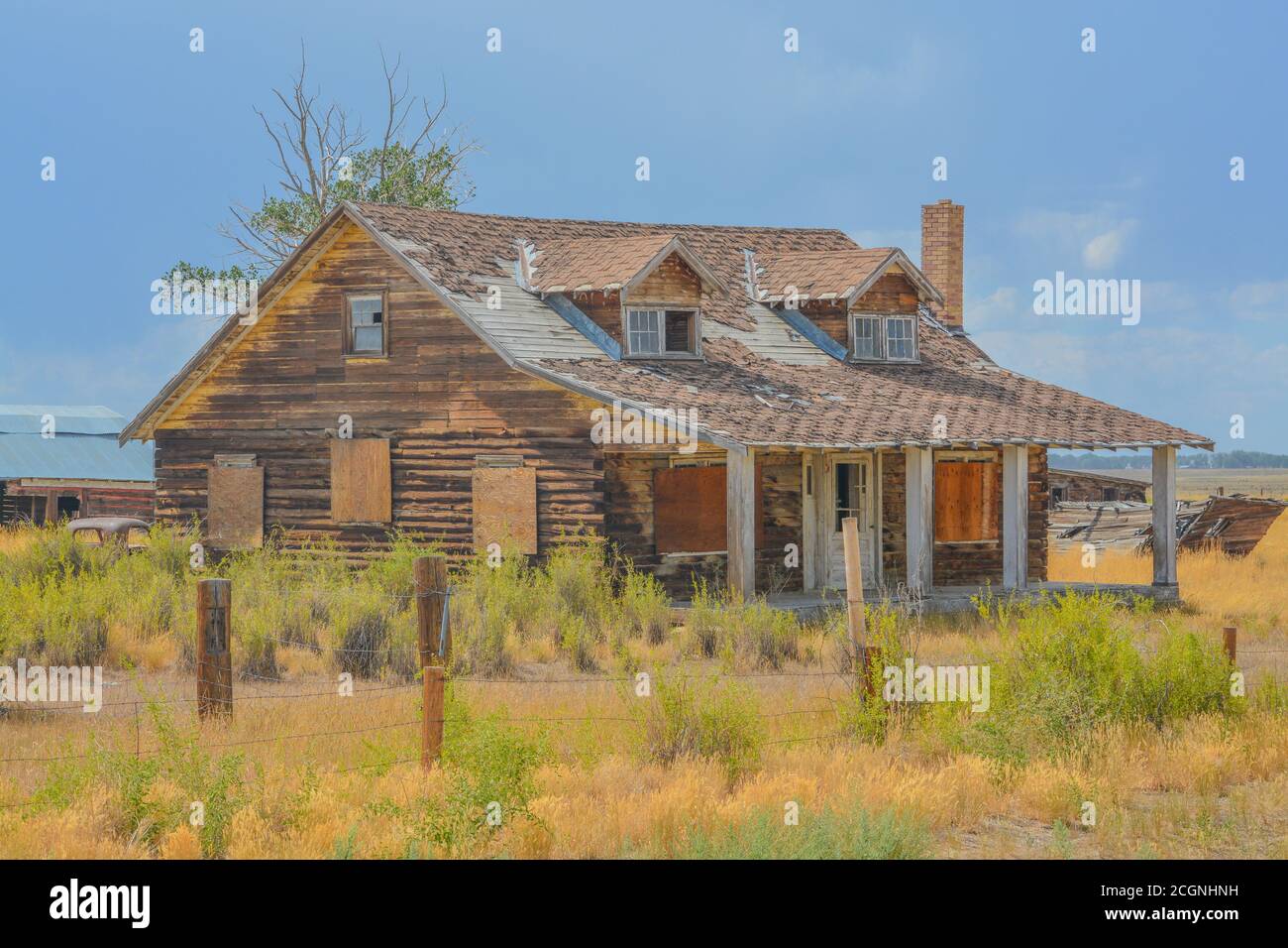 A rustic, rundown, old abandoned, ruined, farm house in the countryside ...