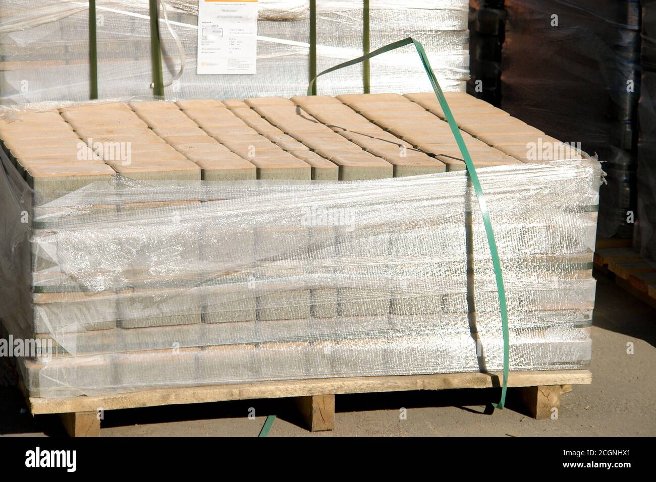 Pavement stones on market. Paving slabs store. Cobblestone on pallets ...