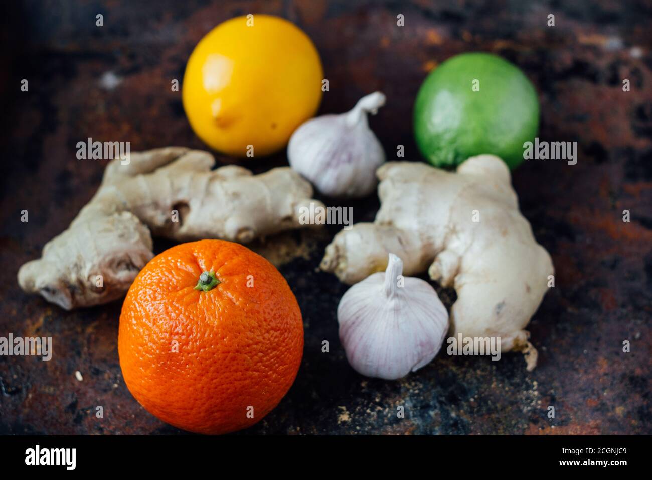 Citrus fruits with garlic and ginger root Stock Photo - Alamy