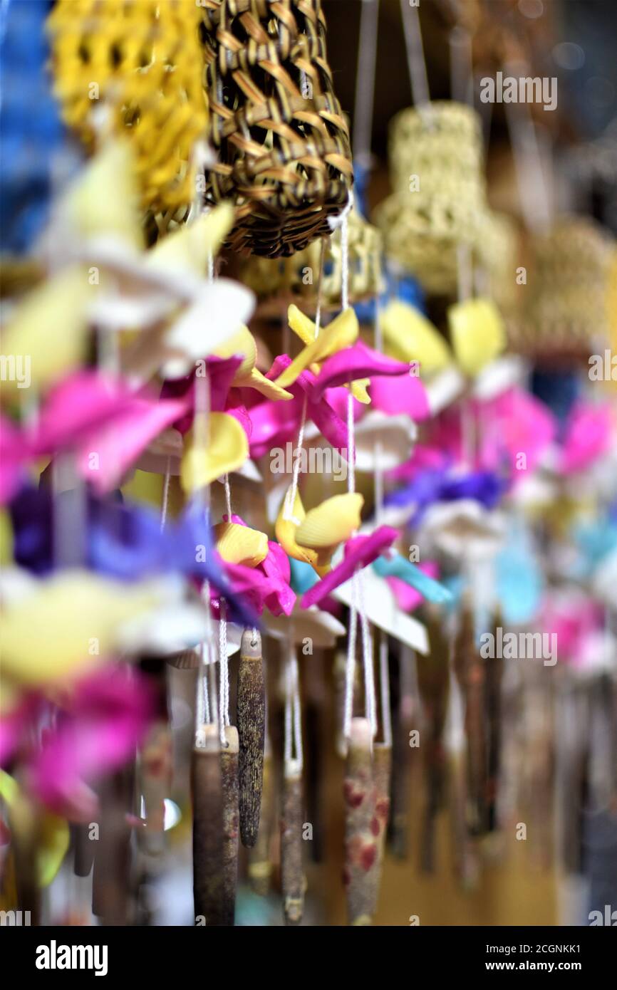 Native wind chimes made of rattan and sea shell adorn an island gift ...
