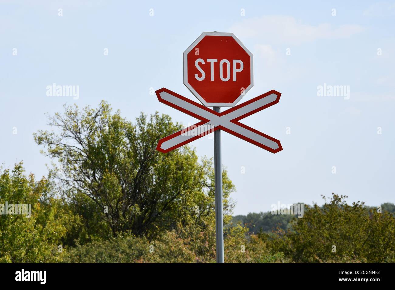 Stop and rail road signs warning drivers on approaching rail track ...