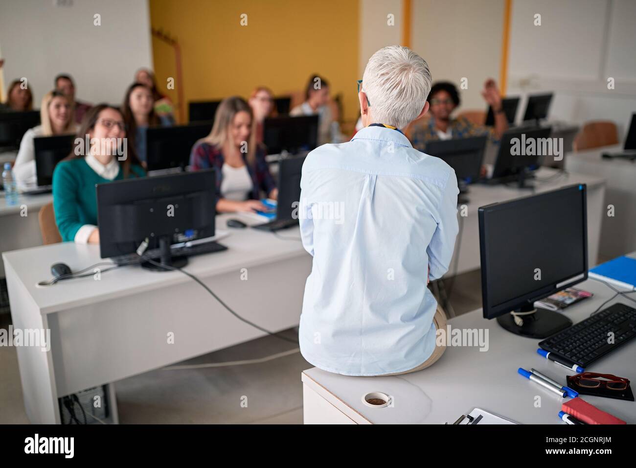 Female professor and her students at an informatics lecture in the ...