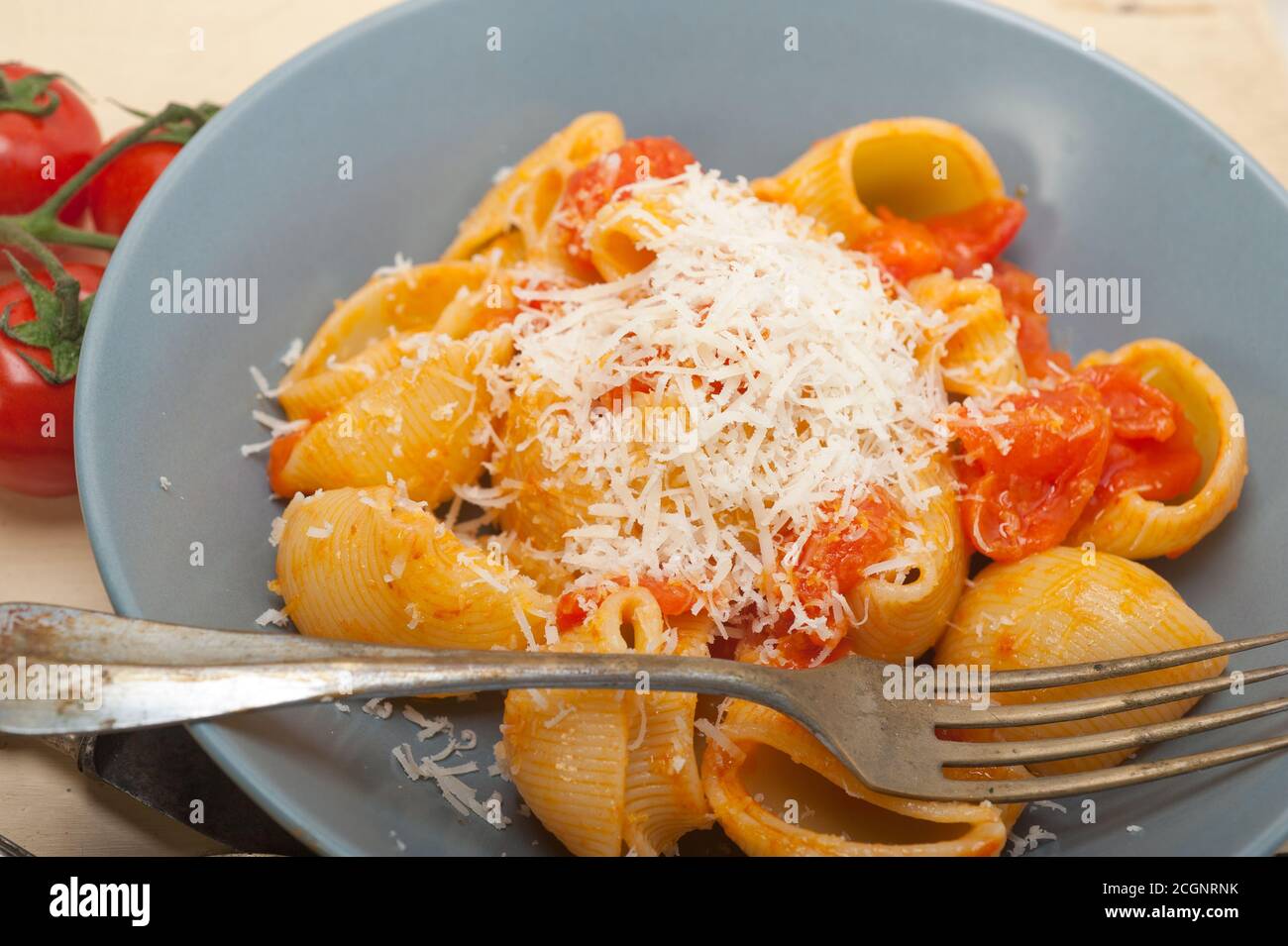Italian snail lumaconi pasta with ripe cherry tomatoes sauce ...