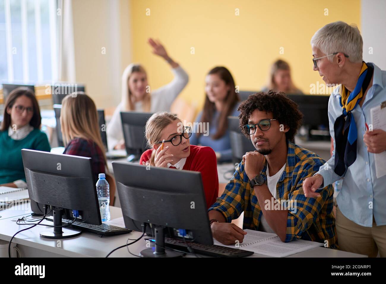 Female professor answering the student question at an informatics ...