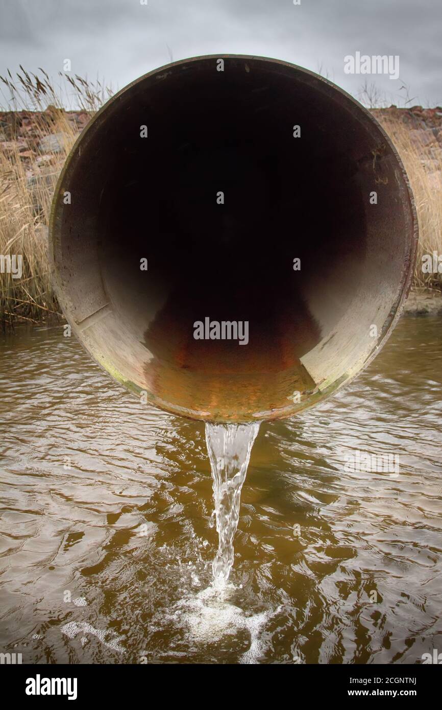 Runoff of excess water through a large-diameter pipe from a water ...