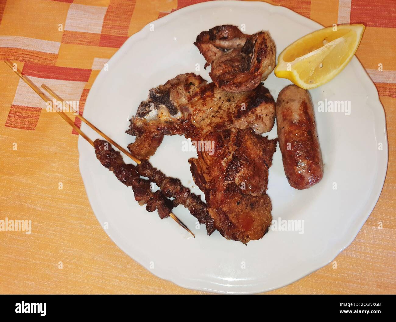 mixed meat dish cooked on the grill Stock Photo - Alamy