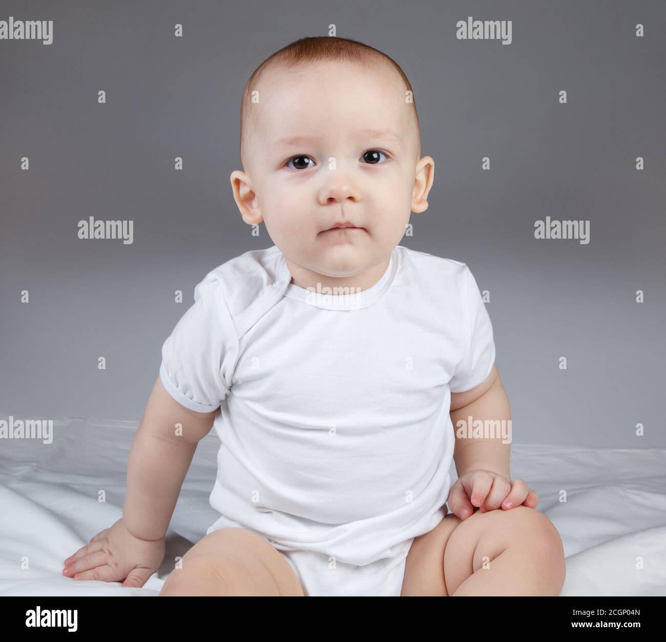Photo a ten-month-old baby on a white background Stock Photo - Alamy