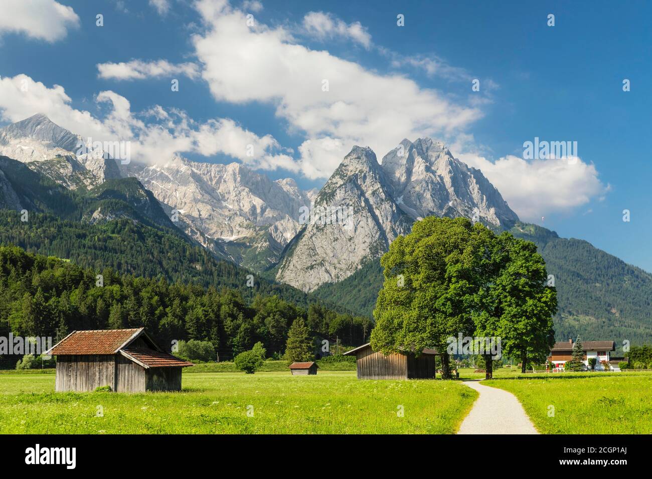 Hay barns at Hammersbach hiking trail towards Wetterstein range ...