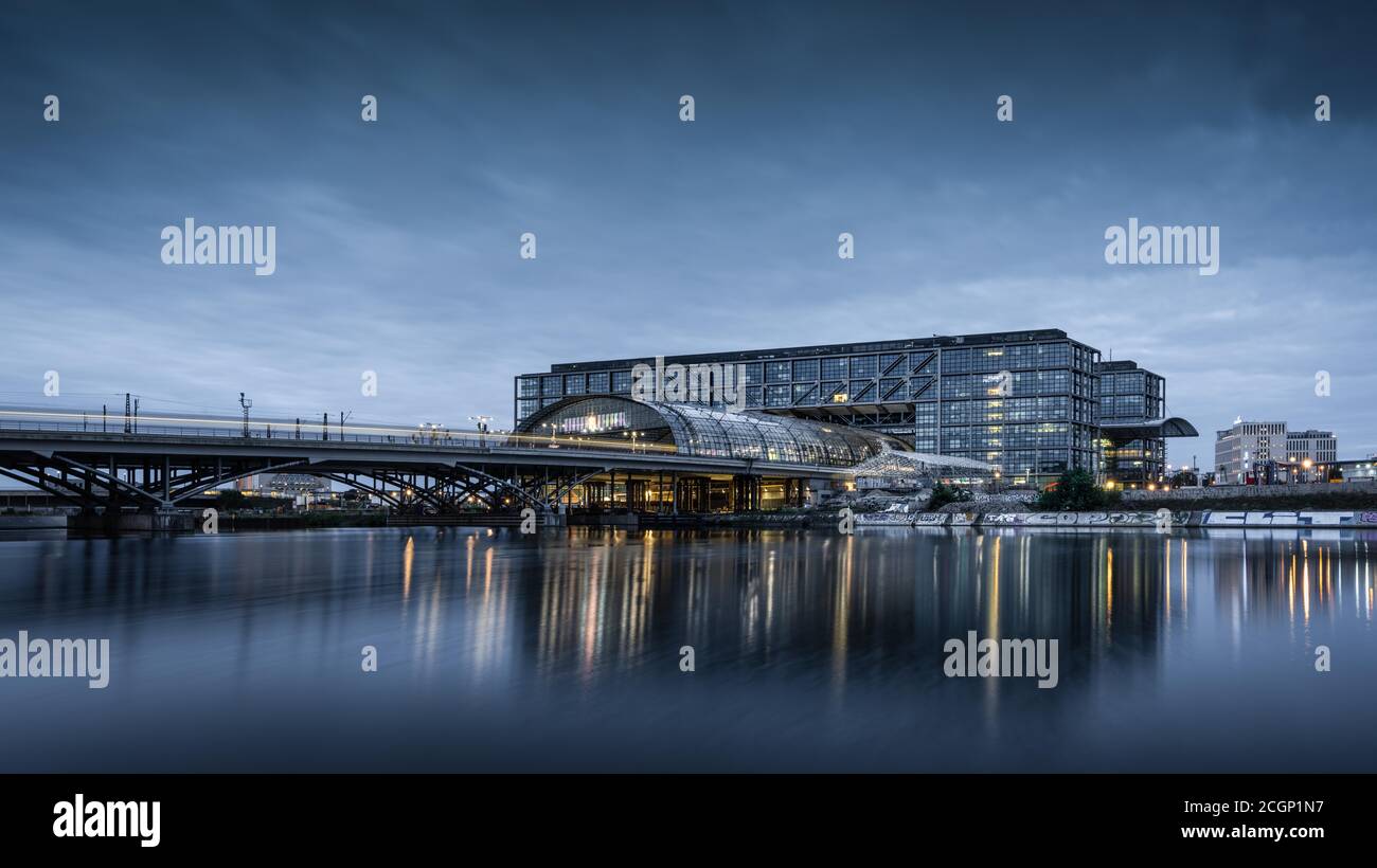 Central station with incoming train at the blue hour hi-res stock ...