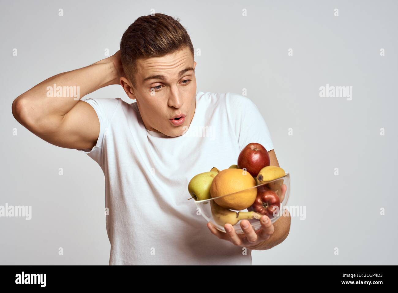 Man with fresh fruit in a cup health lifestyle healthy nutrition ...