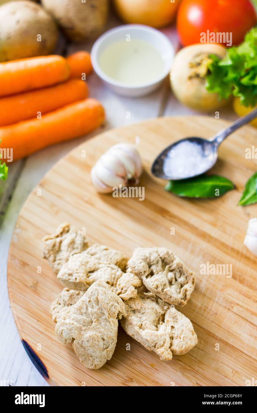 Vegetarian meat made from soy beans on wooden board Stock Photo - Alamy