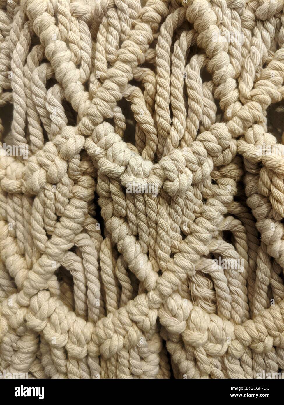 Beige wall hanging macrame detail texture Stock Photo - Alamy