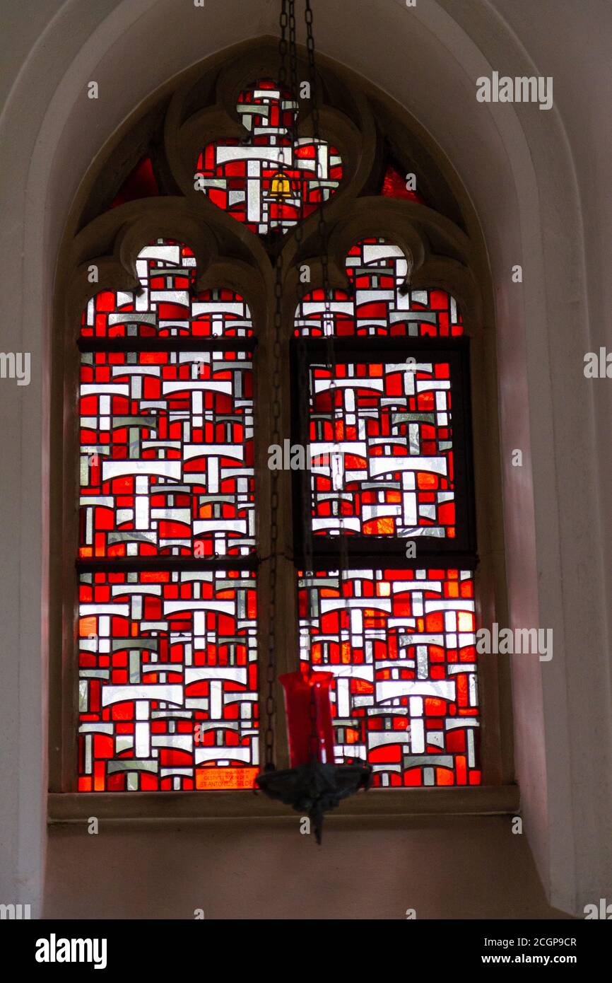 Red stained glass in the church Stock Photo - Alamy
