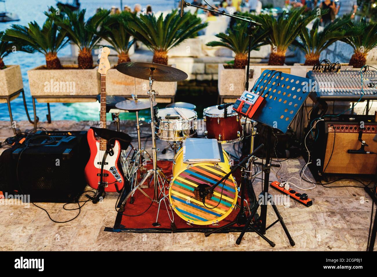 A platform for musicians with musical instruments, a drum kit, a guitar ...