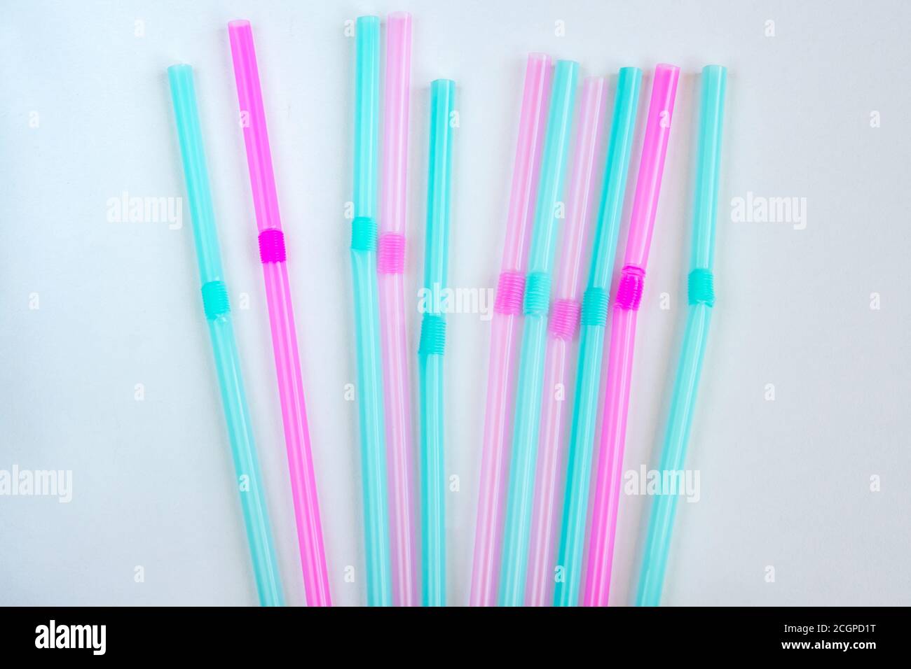 blue, pink straws for cocktails and other drinks isolated on white ...