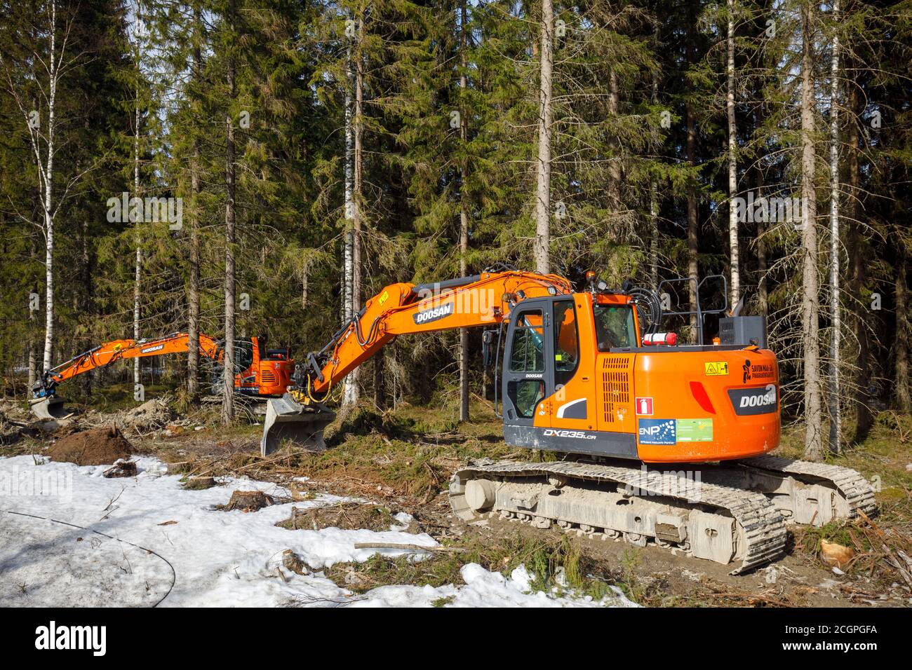 Orange Doosan DX235LCR digger in the forest , Finland Stock Photo - Alamy
