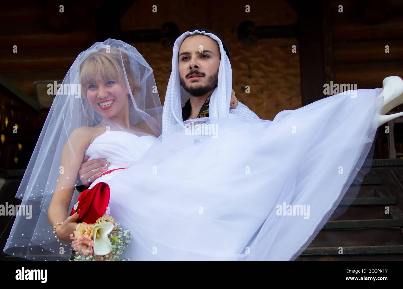 Groom Arab and European bride. International couples Stock Photo - Alamy
