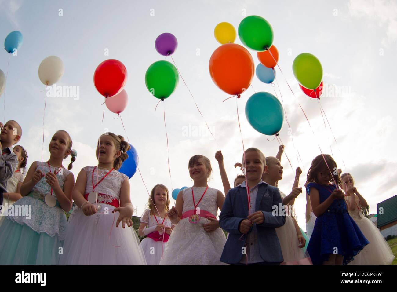 Graduation in kindergarten. Elegant children graduates of a ...