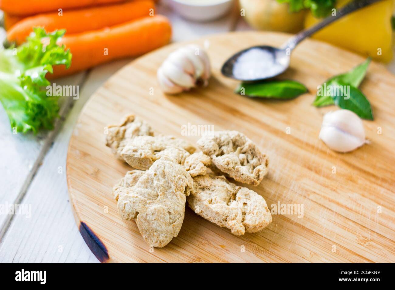 Vegetarian meat made from soy beans on wooden board Stock Photo - Alamy