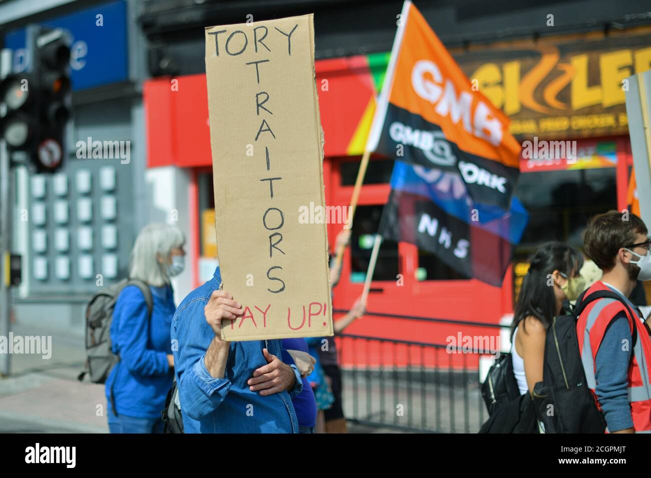 People march with placards through Bristol city centre, as marches and ...