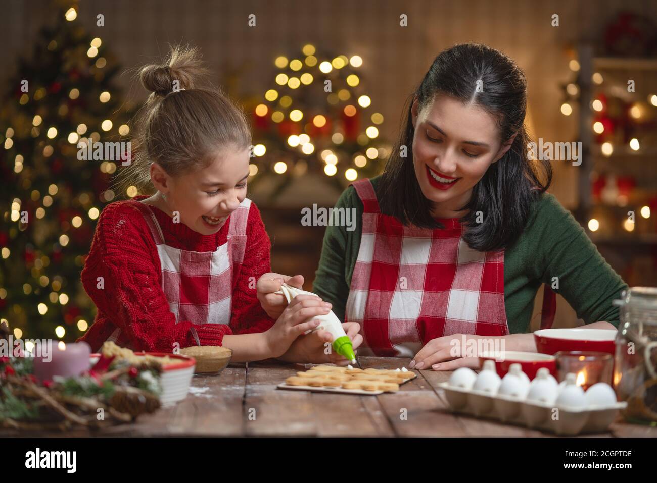 Merry Christmas and Happy Holidays. Family preparation holiday food ...