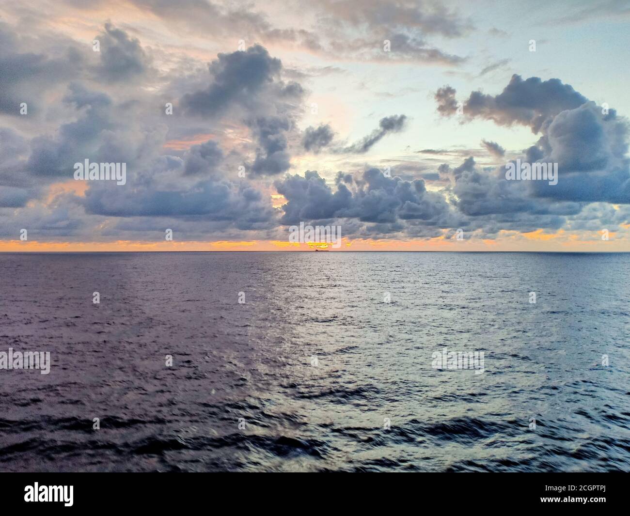 sunrise cloudy sky and beautiful ocean Stock Photo - Alamy