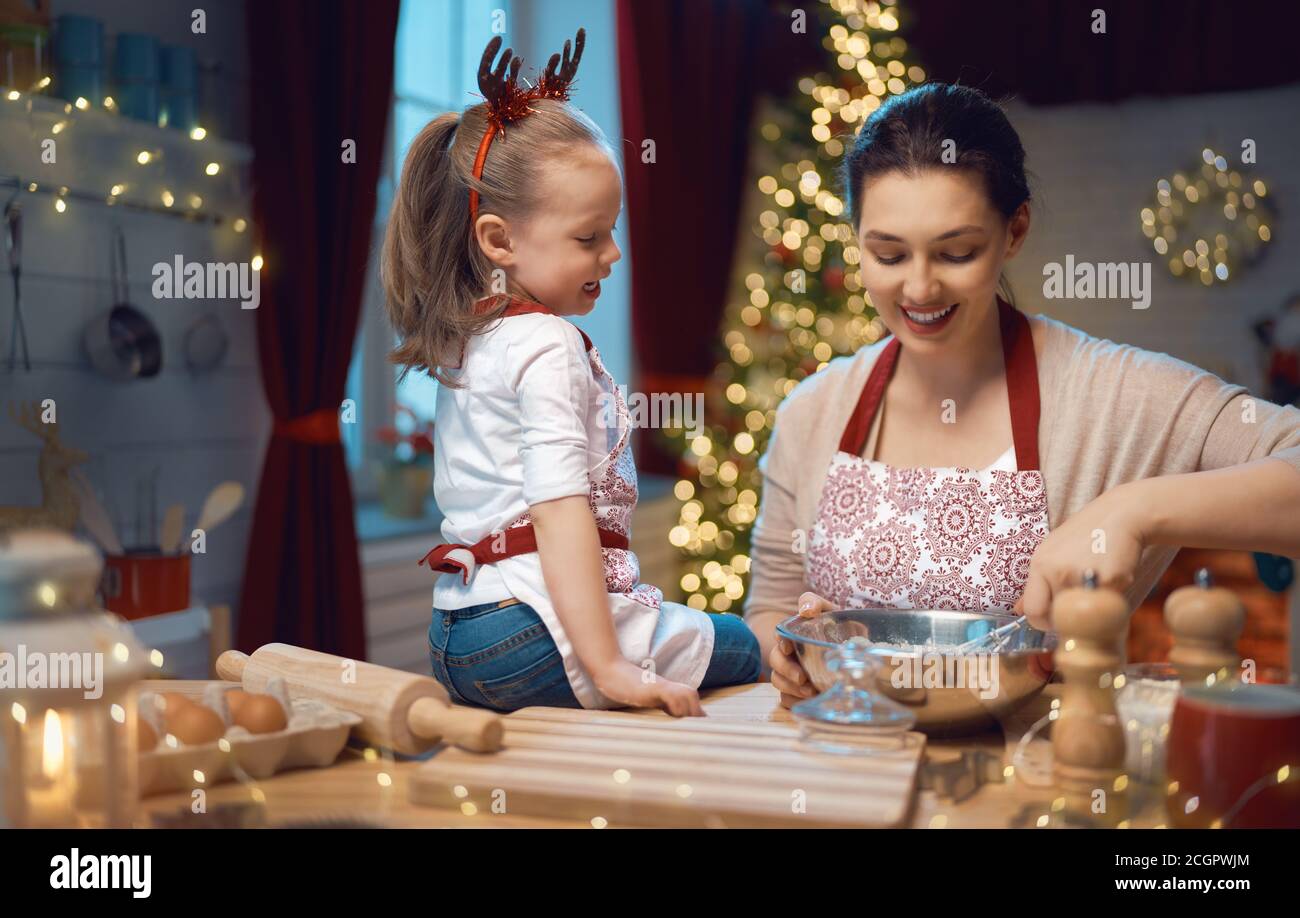 Merry Christmas and Happy Holidays. Family preparation holiday food ...