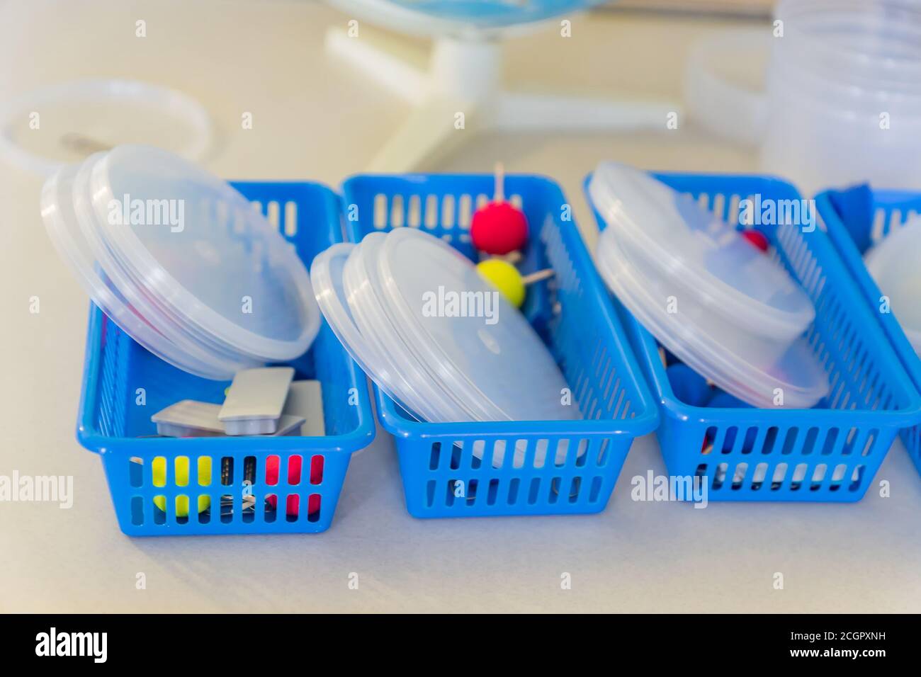 School laboratory stuff in a blue plastic containers. study of natural ...