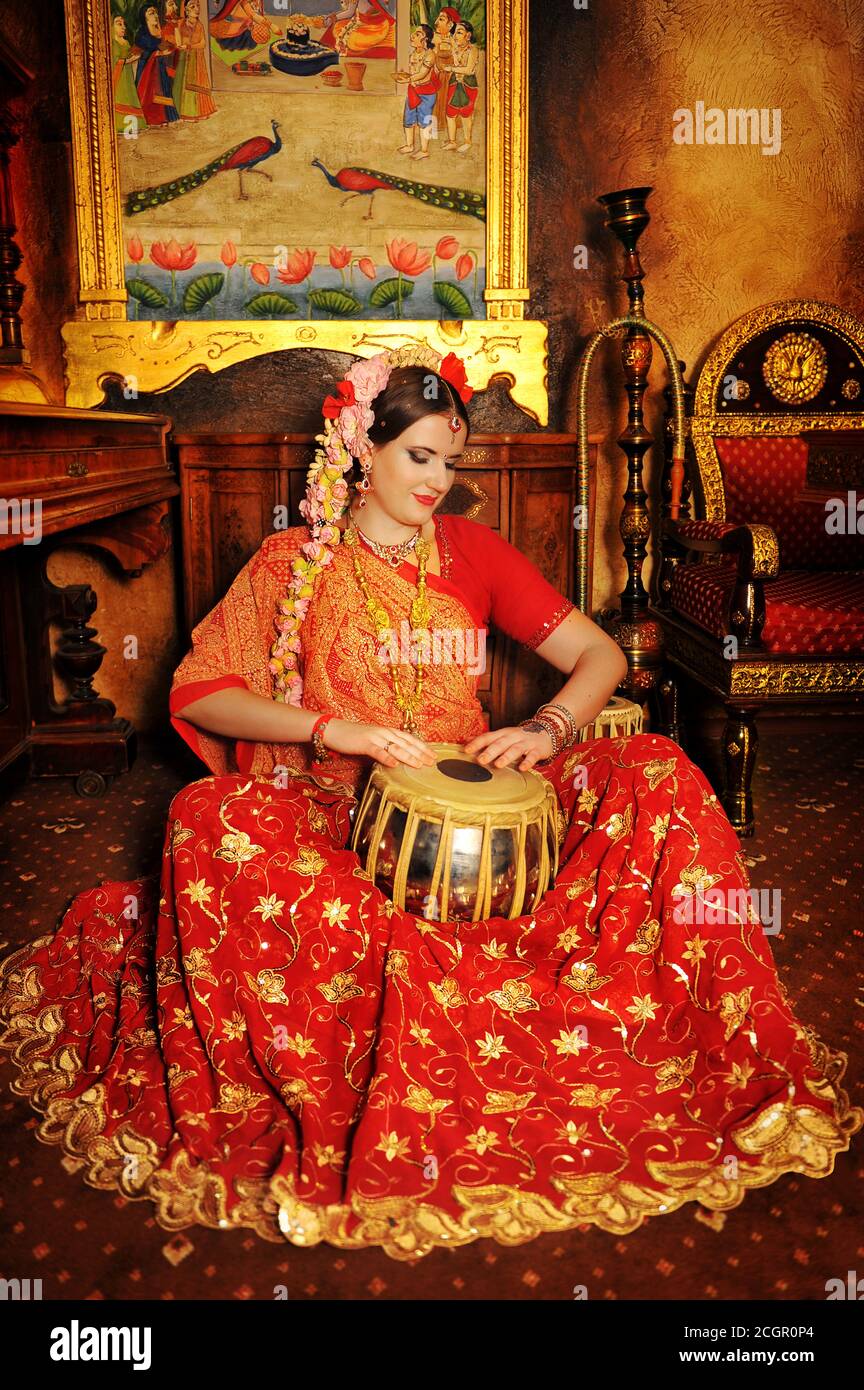 beautiful photo of a woman in a red sari. Model release is available ...