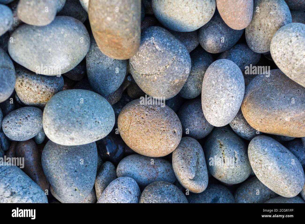Smooth, round pebbles and rocks at a beach in Surigao City Stock Photo ...