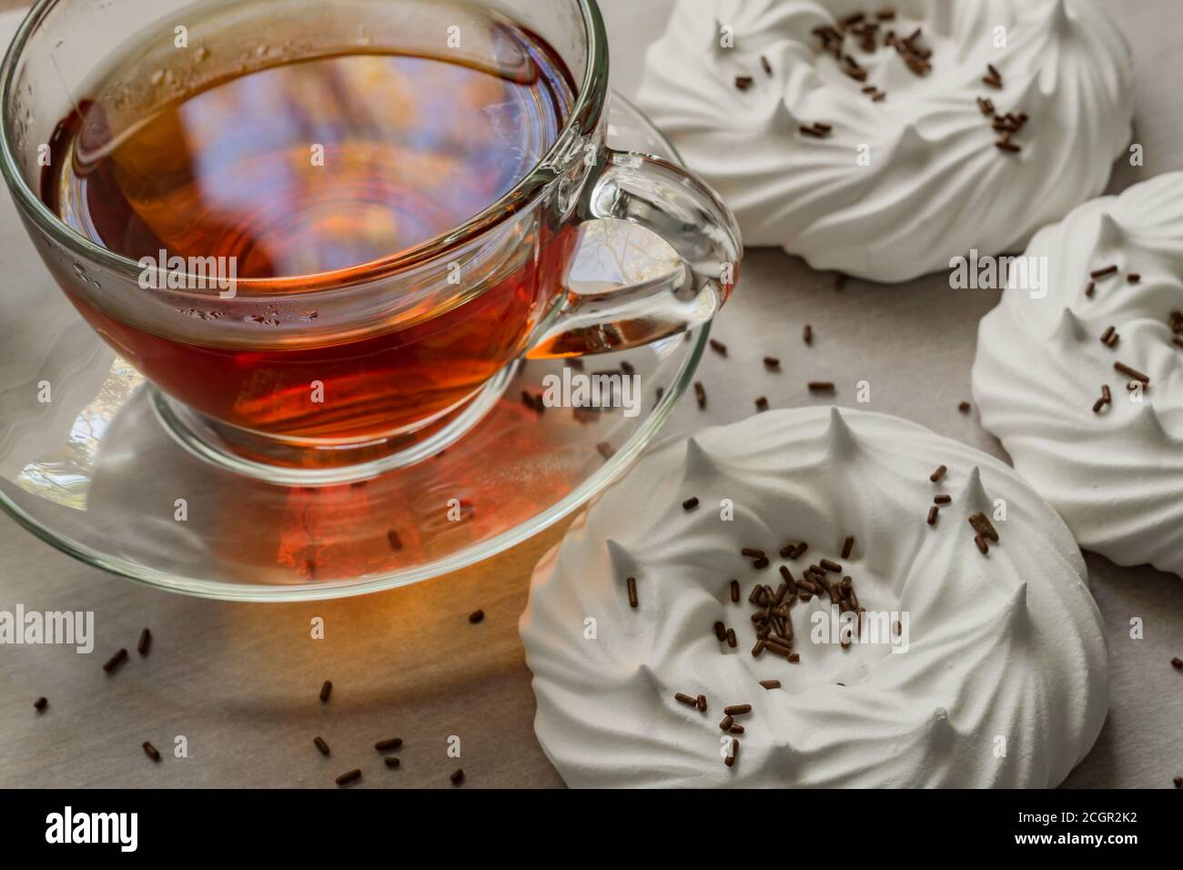 black tea in transparent cup an air homemade meringues close up Stock ...
