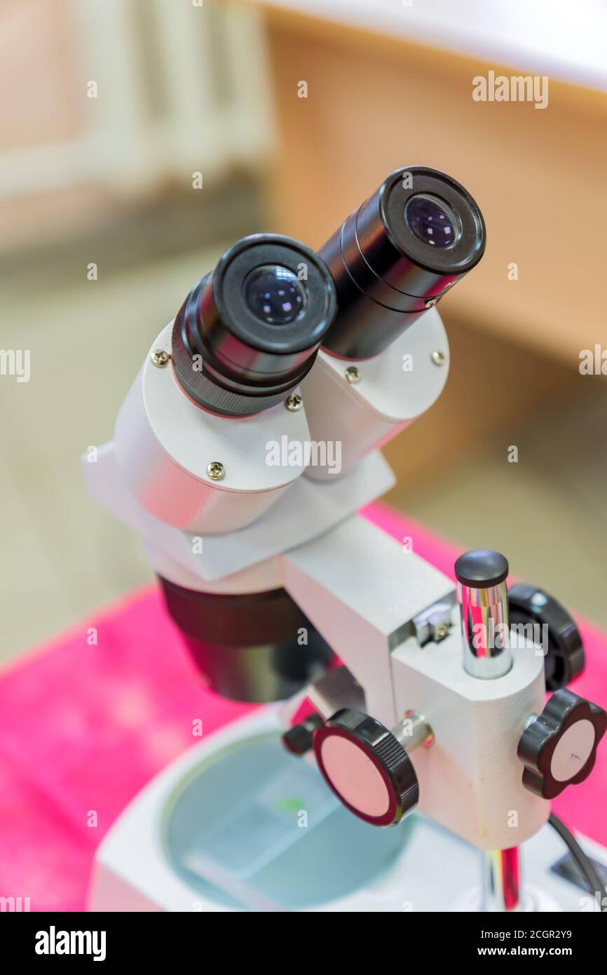 Laboratory Equipment, Optical Microscope for school lessons on red ...