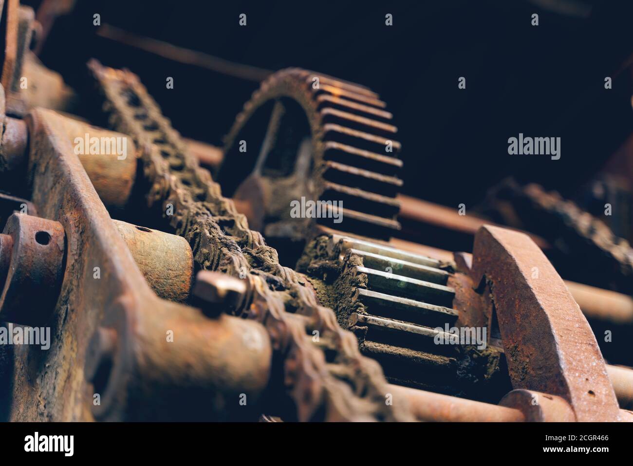 Close up chains that are part of a machine are old and dirty and stain ...