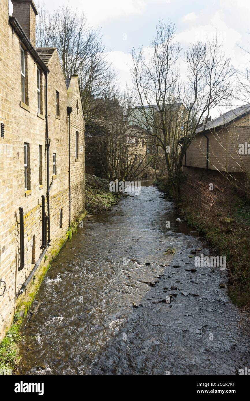 Bridgehouse Beck running between of commercial buildings in Haworth ...