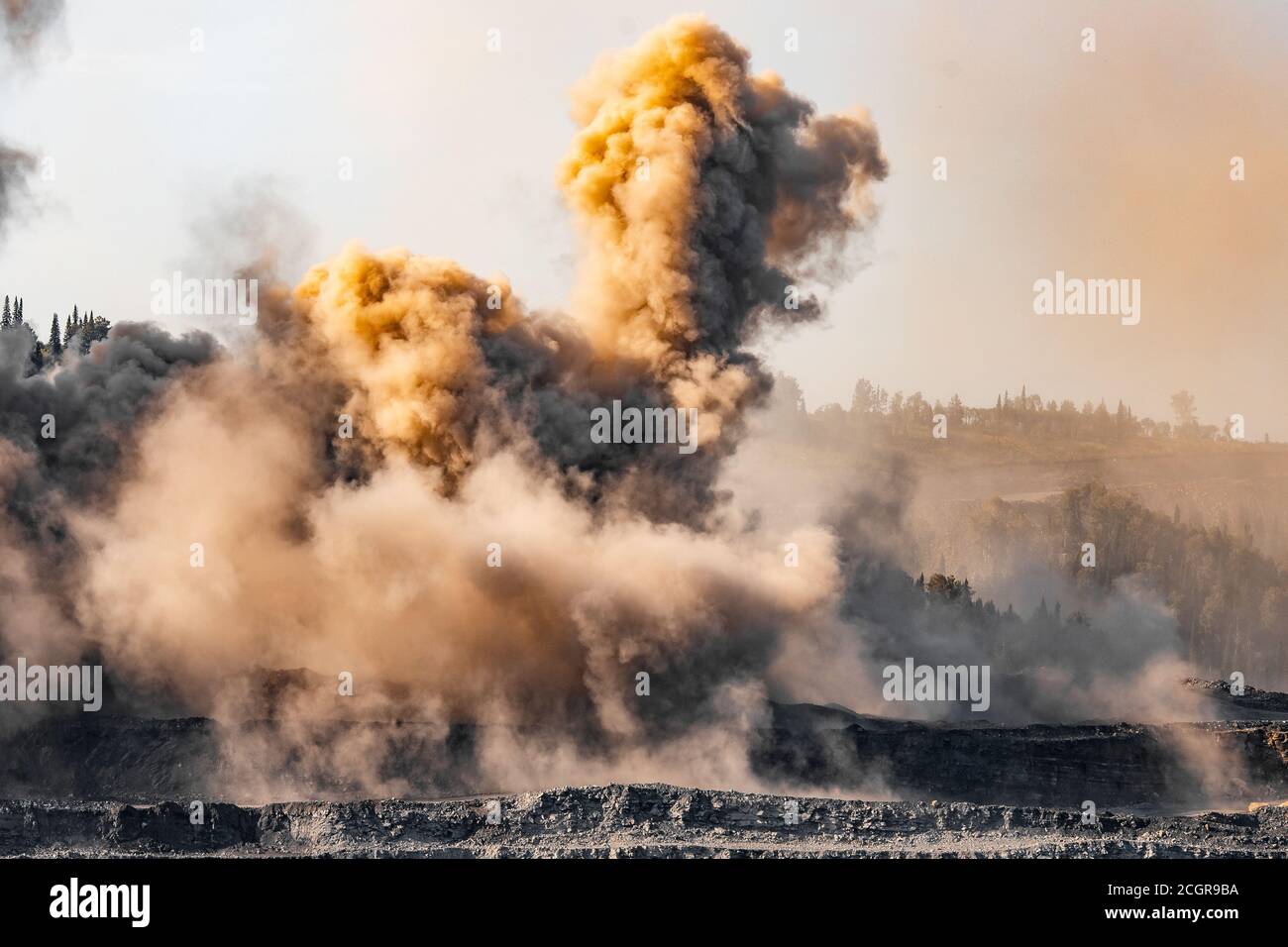 Explosive works on open pit coal mine industry Stock Photo - Alamy